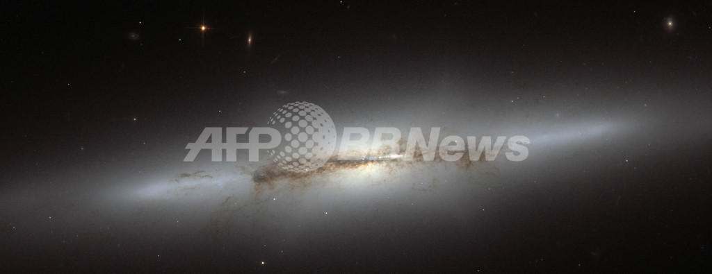 乙女座銀河団の銀河「NGC 4710」 写真1枚 国際ニュース：AFPBB News