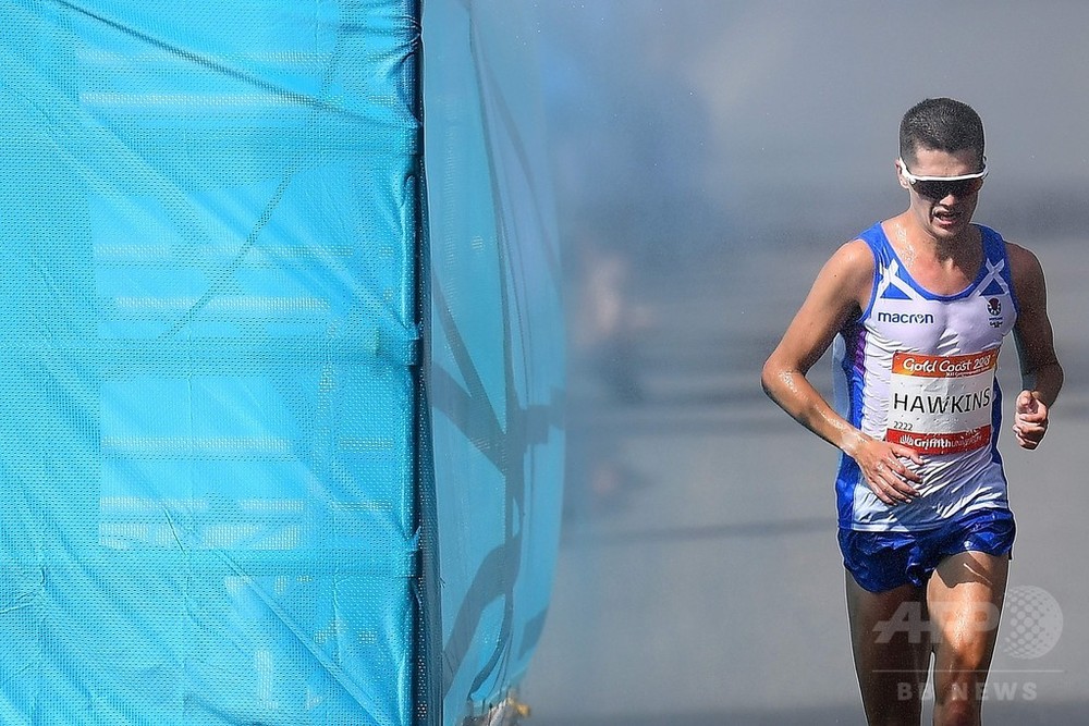 マラソン独走選手が酷暑で倒れ救急搬送、対応に批判の声も 英連邦大会 写真3枚 国際ニュース：AFPBB News